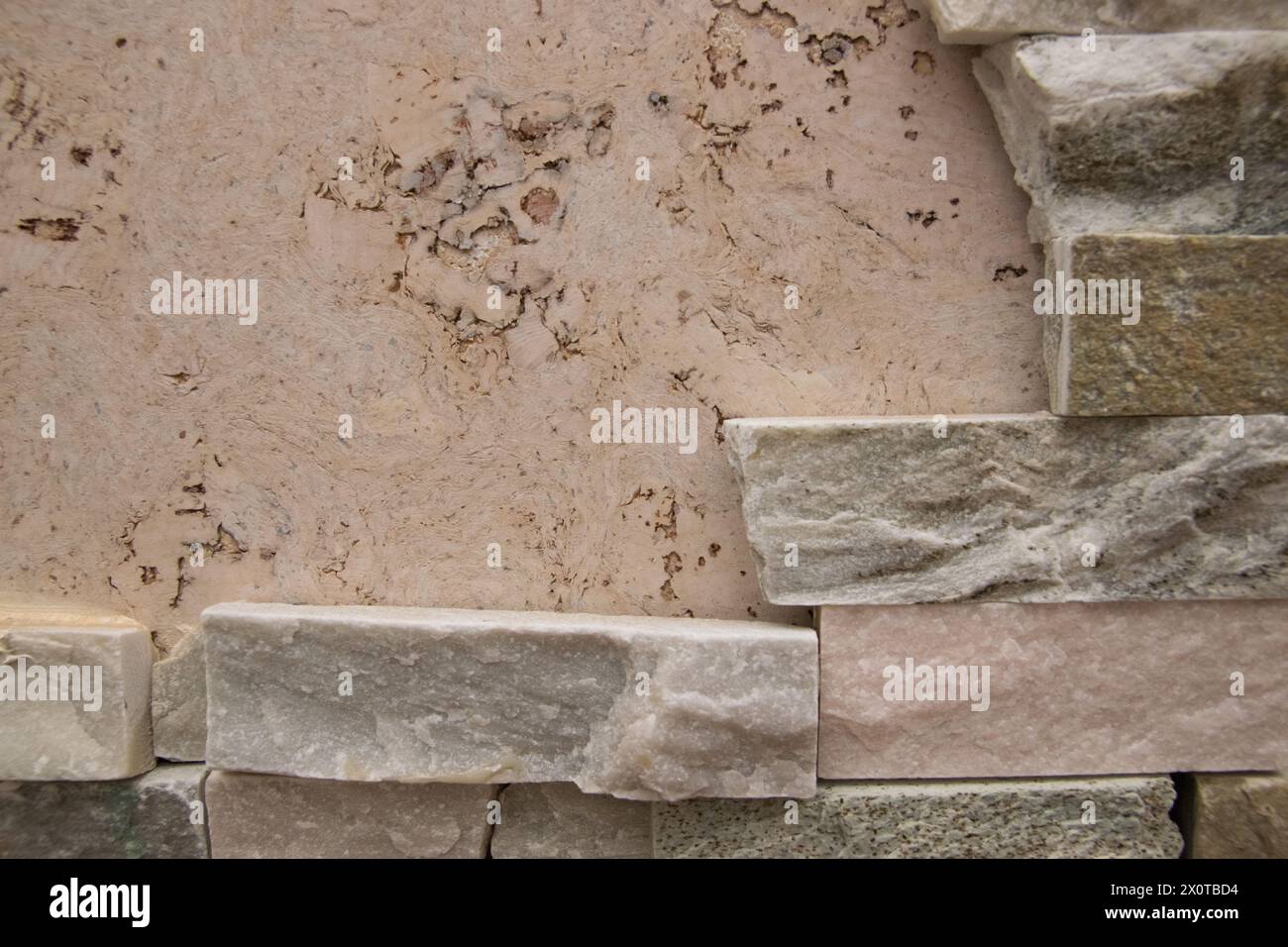 Beautiful beige structural stone wall of the ancient building consists ...