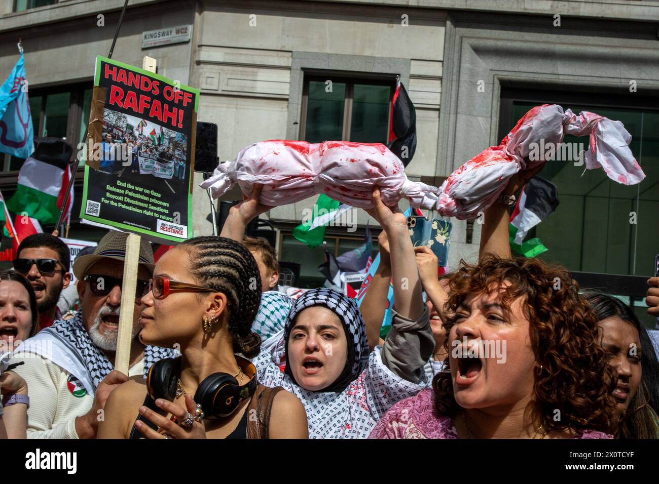 London, UK. 13th Apr, 2024. Protestors hold effigies of children during ...