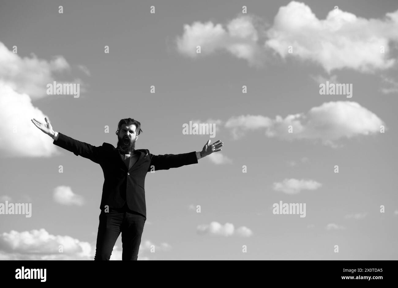Man in suit raising hand on sky background. Freedom adventure and ...