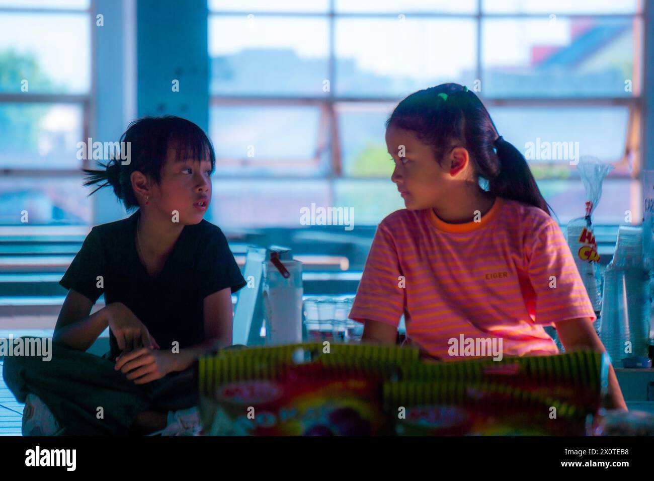 Two beautiful kids sit together in traditional market Stock Photo - Alamy Two beautiful kids sit together in traditional market Stock Photo - Alamy