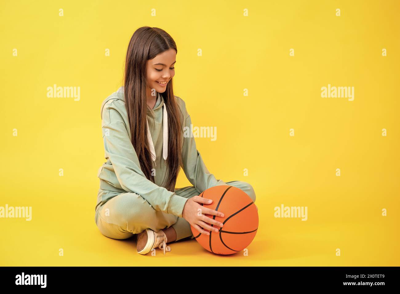 Teen girl excelling in basketball. Skilled teen girl playing the ...