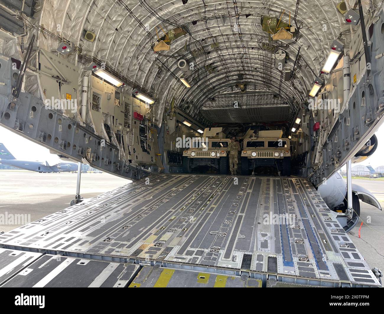 U.S. Air Force Reserve air crew maneuver tactical vehicles assigned to ...