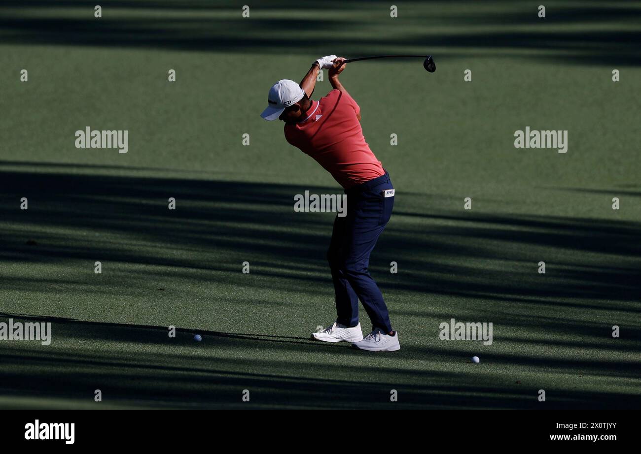 Augusta, United States. 13th Apr, 2024. Collin Morikawa hits an ...