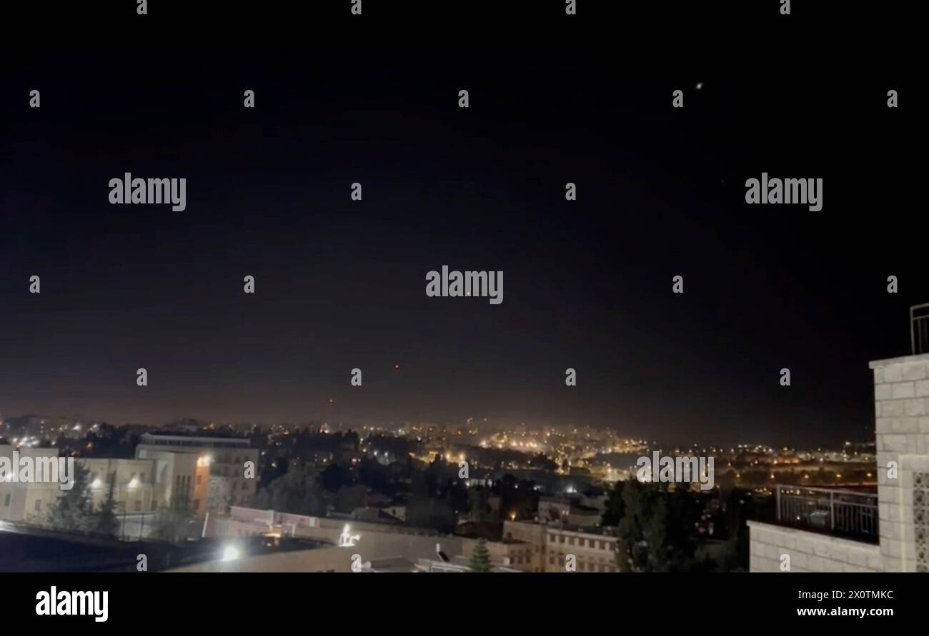 Interceptors missiles are launched into the sky early Sunday, April 14 ...