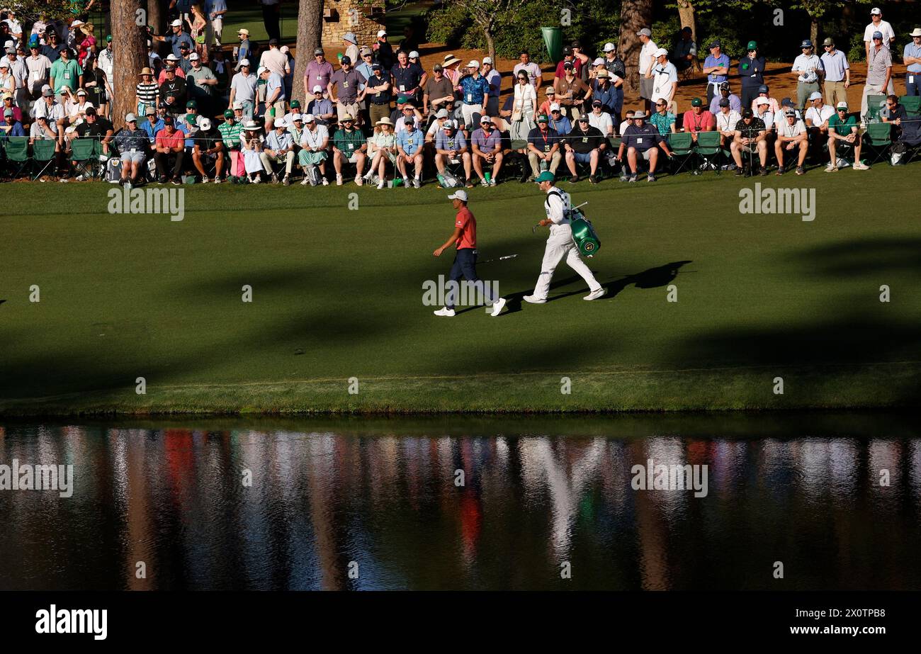 Augusta, United States. 13th Apr, 2024. Collin Morikawa and his caddie ...