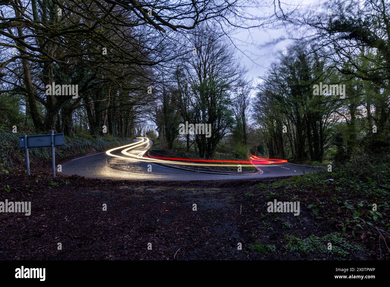 Long exposure capturing the motion of car lights bending along a ...