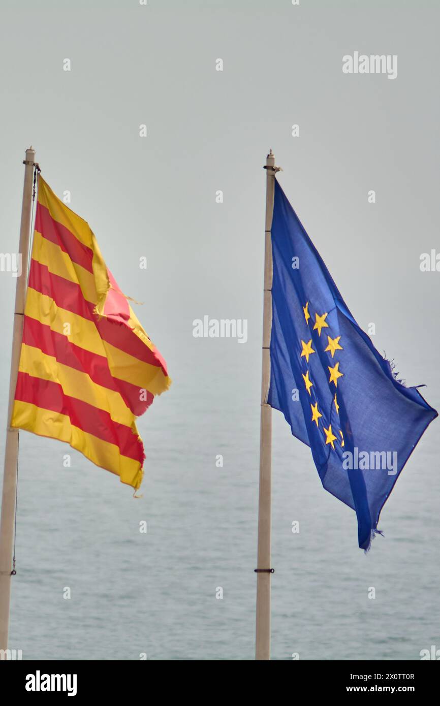 Flags of Catalonia and the European Union flutter in perfect harmony ...