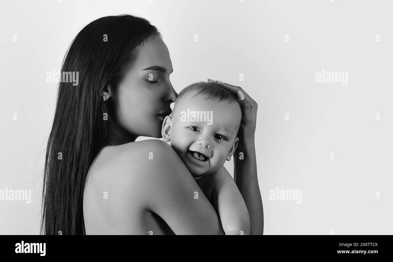 Mother hug. Closeup studio portrait of mother and baby child isolated ...