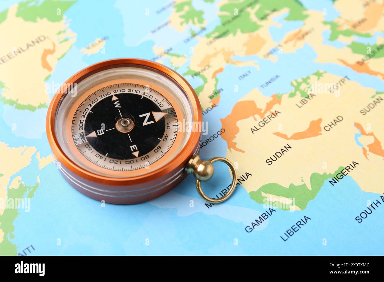 One compass on world map, space for text Stock Photo - Alamy