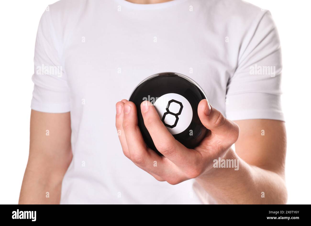 Man holding magic eight ball on white background, closeup Stock Photo ...