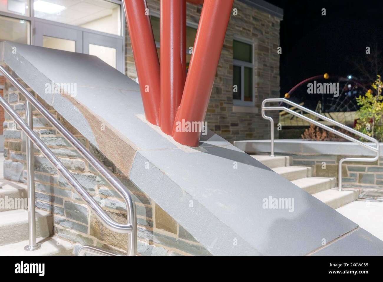 Example of a stainless steel railing along an exterior set of stairs at ...