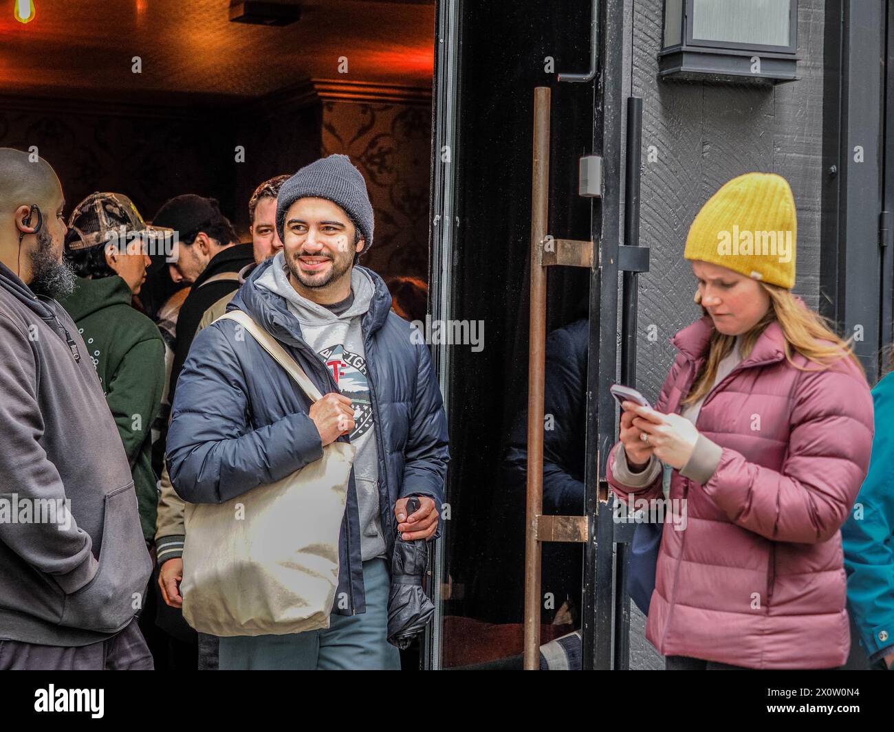 Ticket and merchandise buyers coming out of the Irving Plaza store with ...