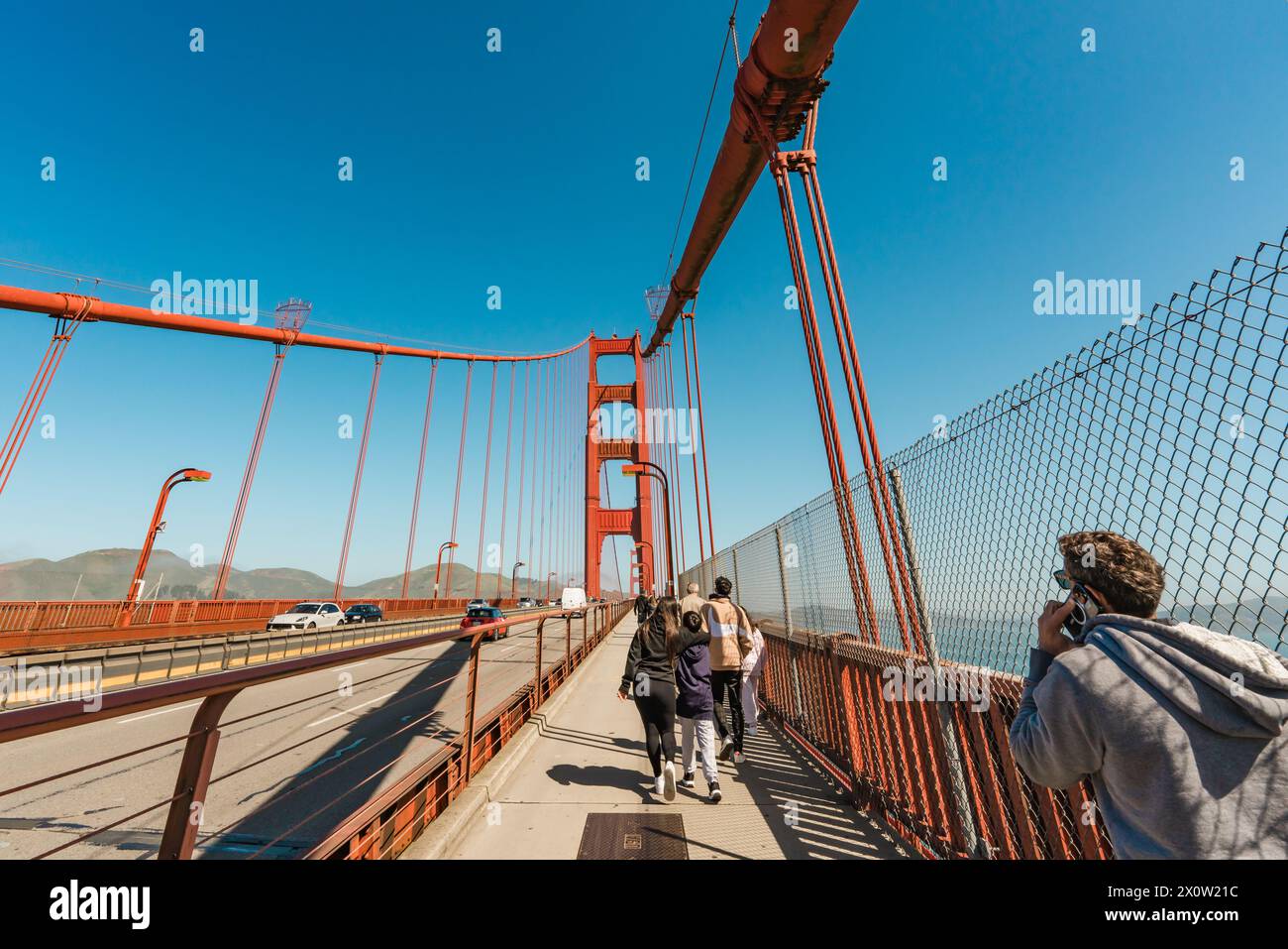 San Francisco, California, April 9, 2024. Pedestrians on the walkway of ...