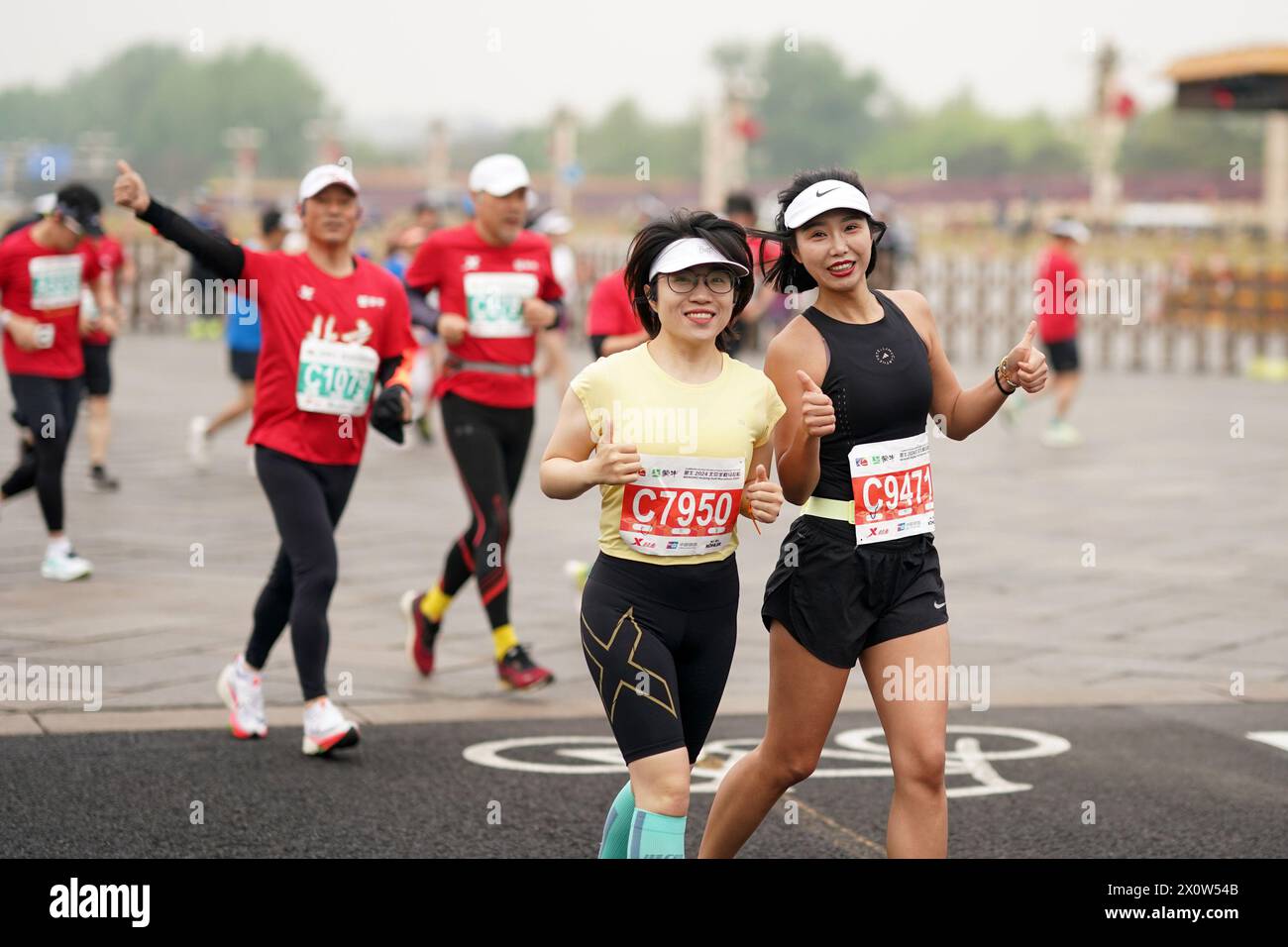 Beijing, China. 14th Apr, 2024. Runners compete during the Bejing Half ...