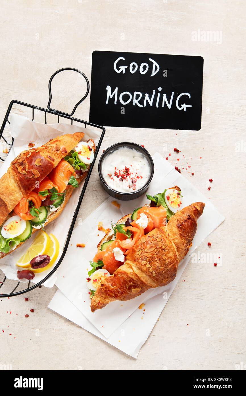 Salted healthy breakfast on light background. Fresh salmon croissant ...