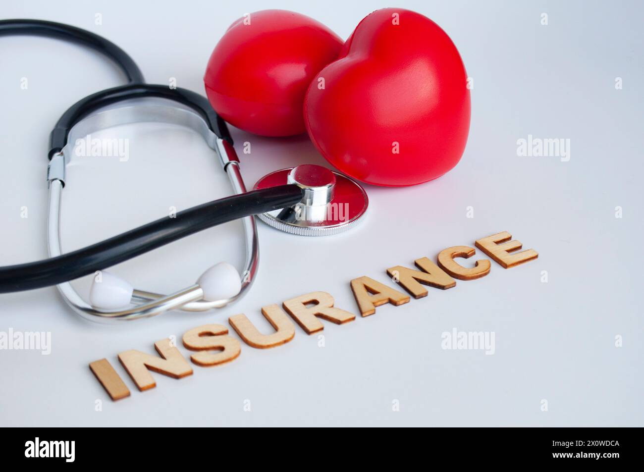 Doctor stethoscopes and heart shape on white background with Insurance ...