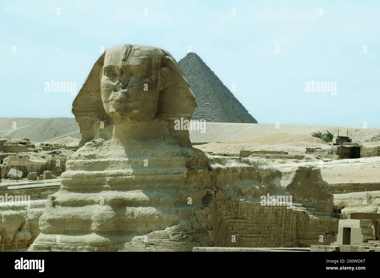 The iconic Great Sphinx in the foreground with the Pyramid of Giza ...