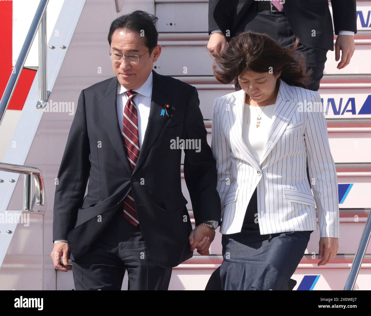 Japanese Prime Minister Fumio Kishida and his wife Yuko arrive at Haneda International Airport ...