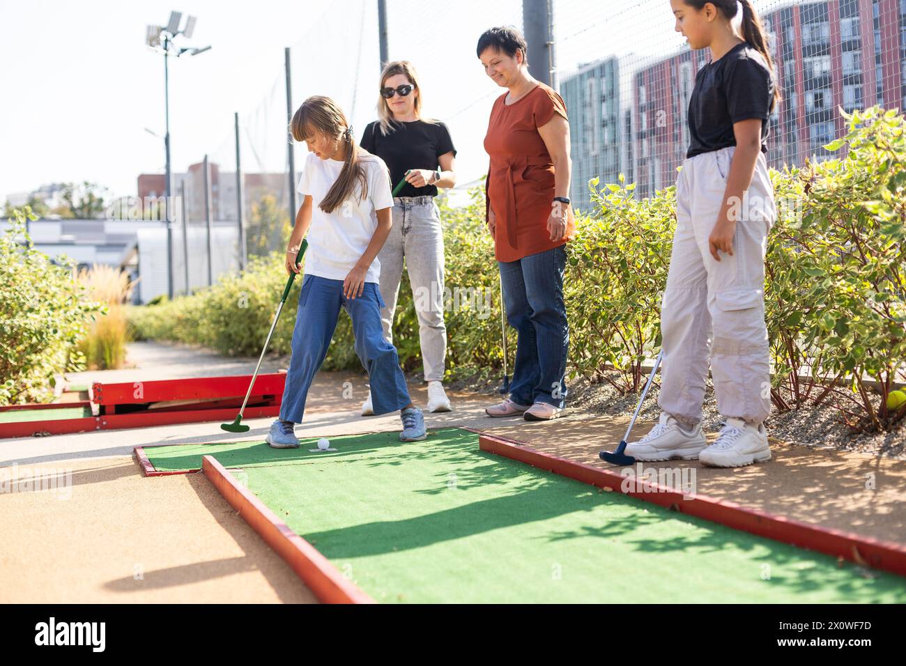 Golf course group of friends people with children posing standing Stock ...
