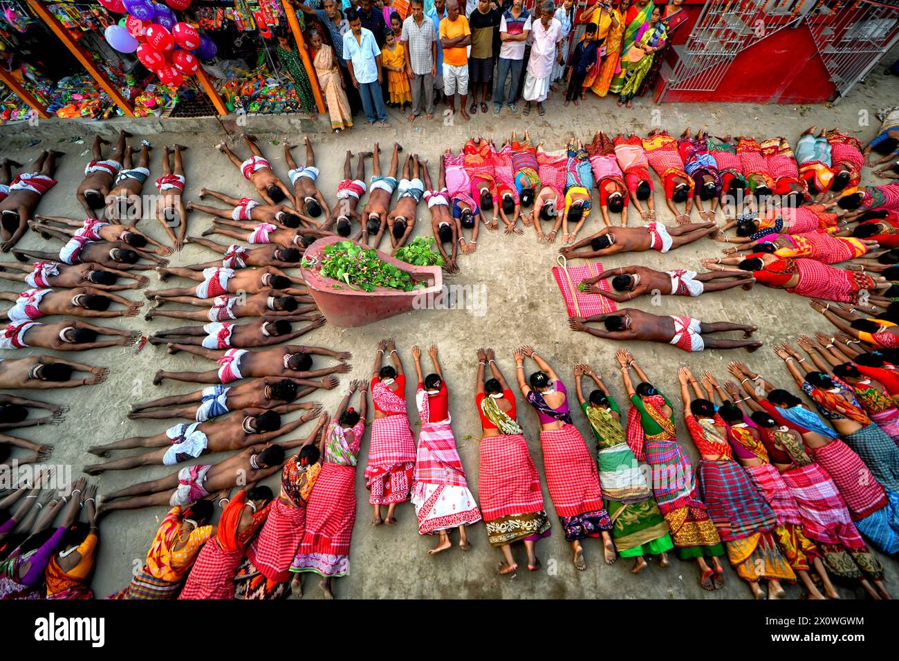 Bagnan, India. 13th Apr, 2024. Hindu devotees seen laid on the ground ...