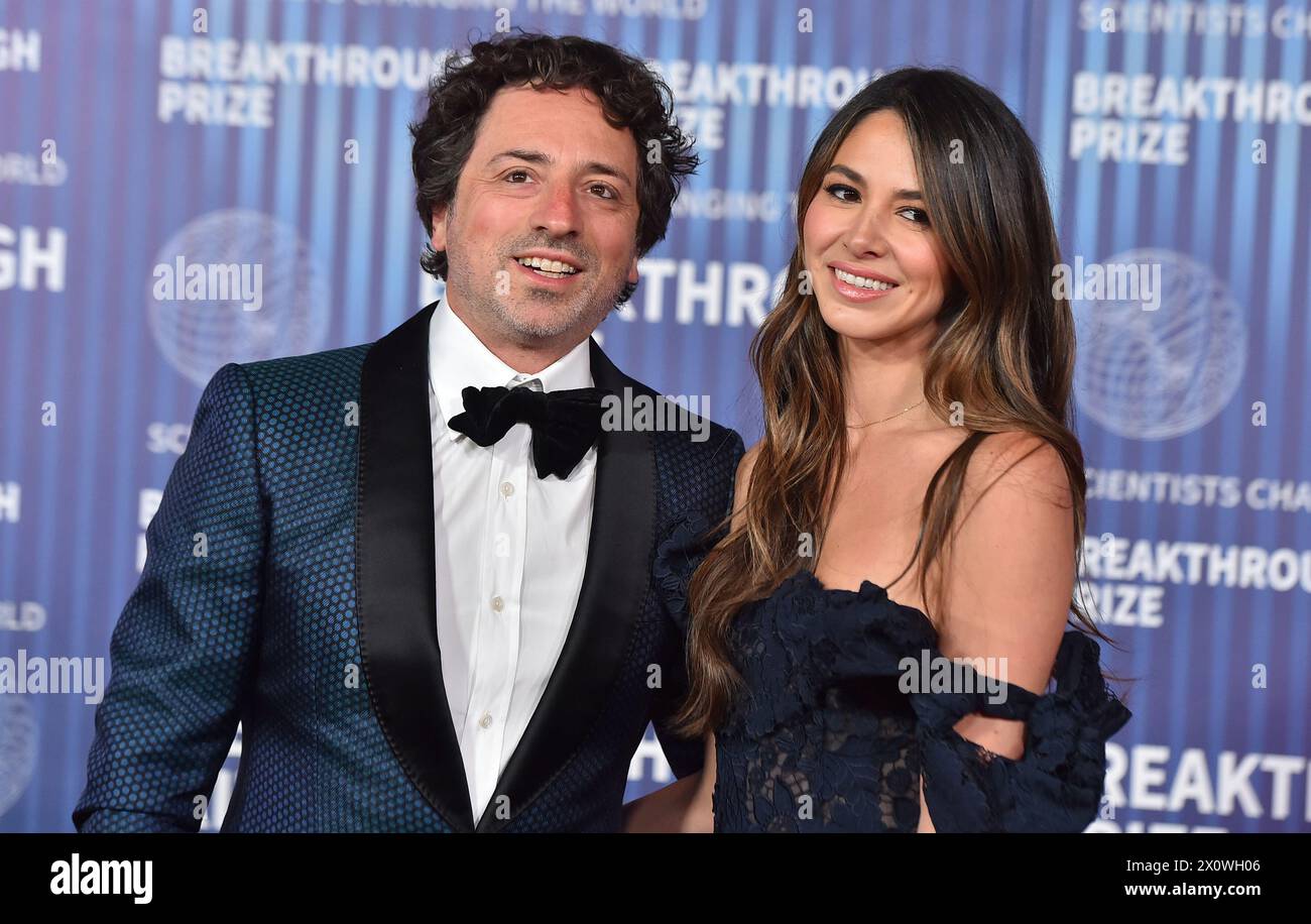 Sergey Brin, left, and Gerelyn Gilbert-Soto arrive at the 10th ...