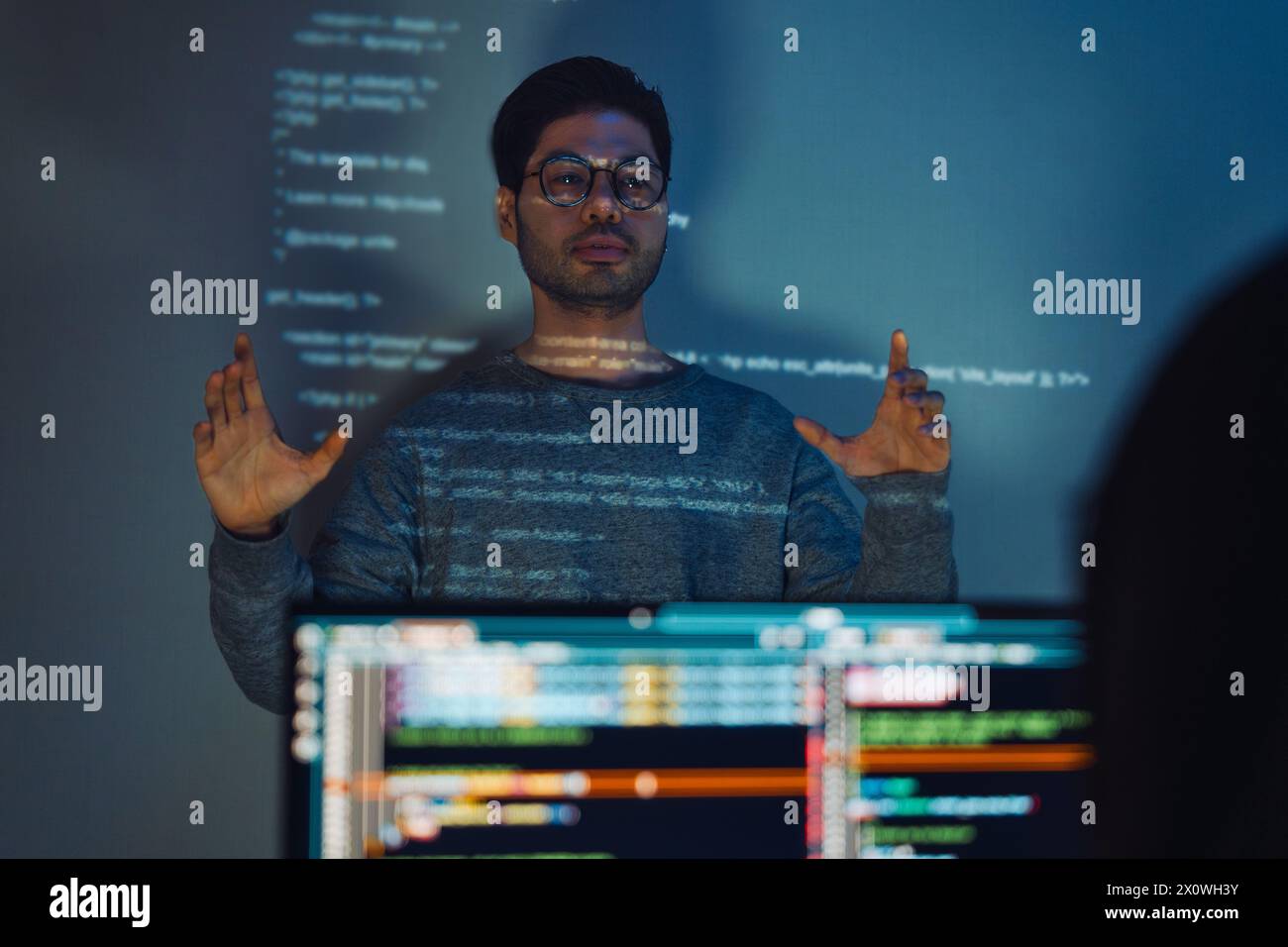 Indian Man Developer Presentation About Coding Software Data With Devops Team At Night In Office