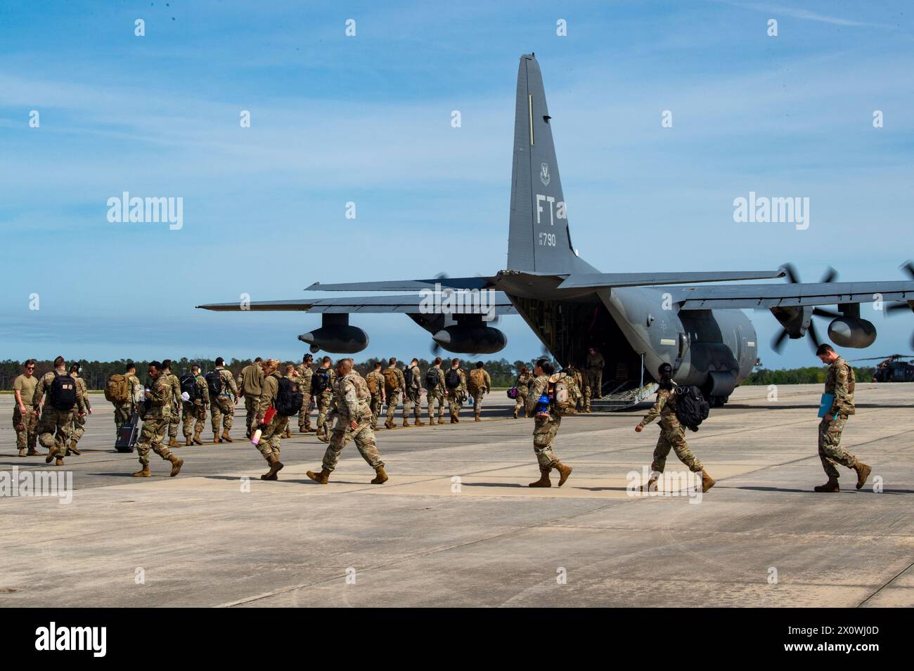 U.S. Air Force Airmen load an HC-130J Combat King II assigned to the ...