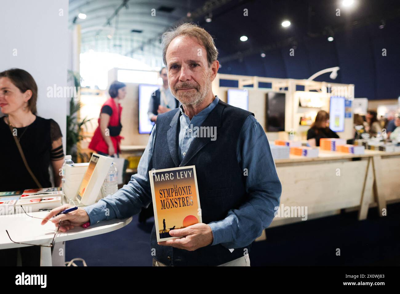 Paris, France. 13th Apr, 2024. Marc Levy signs his book at the Paris ...