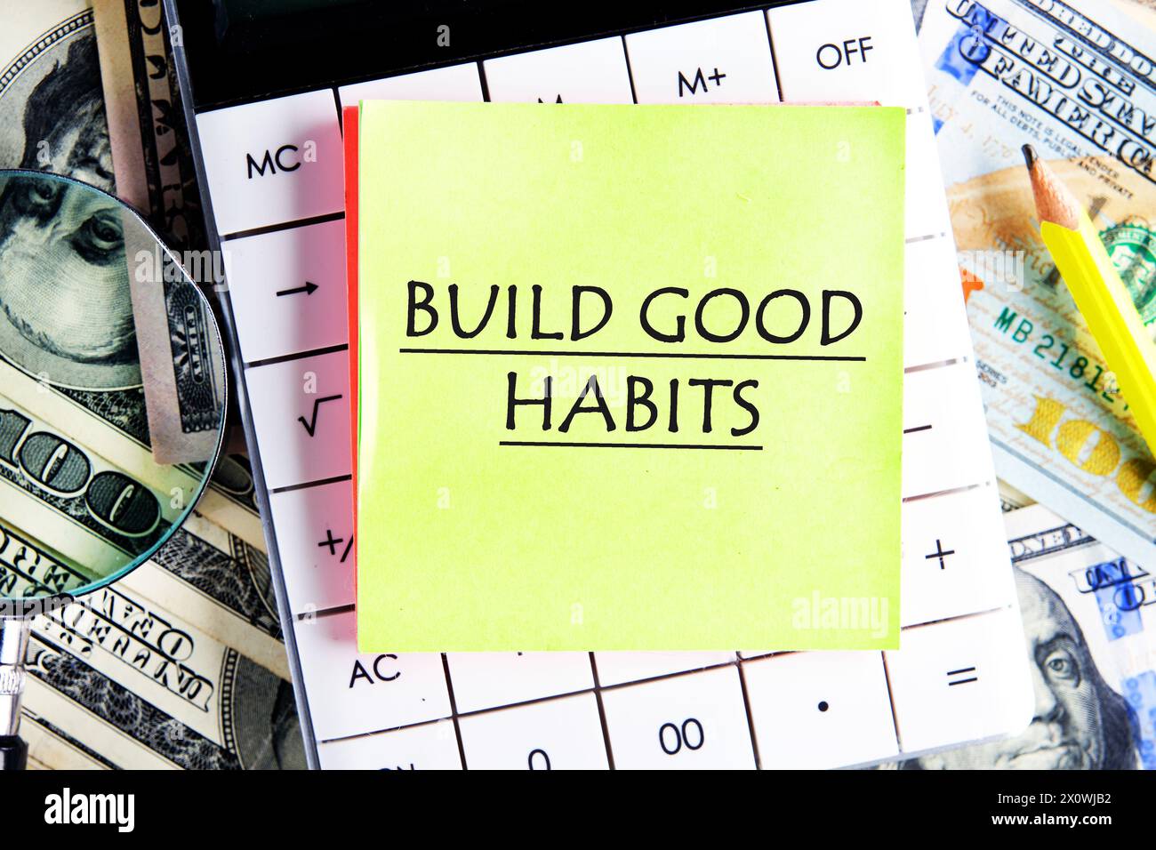 BUILD GOOD HABITS motivational concept text on a yellow sticker on the ...
