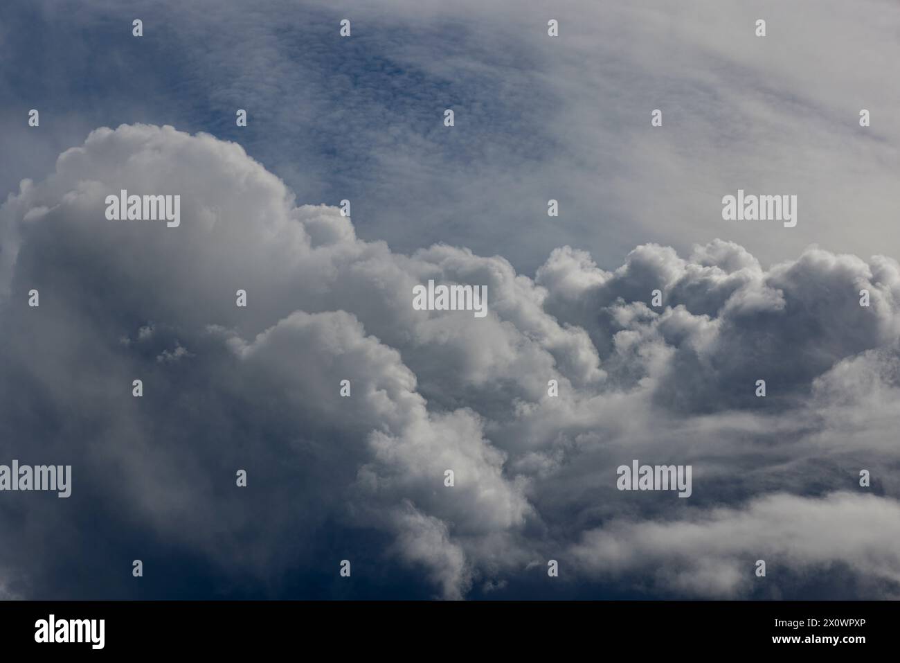 Large fluffy puffy cumulus clouds with some blue sky appearing through ...