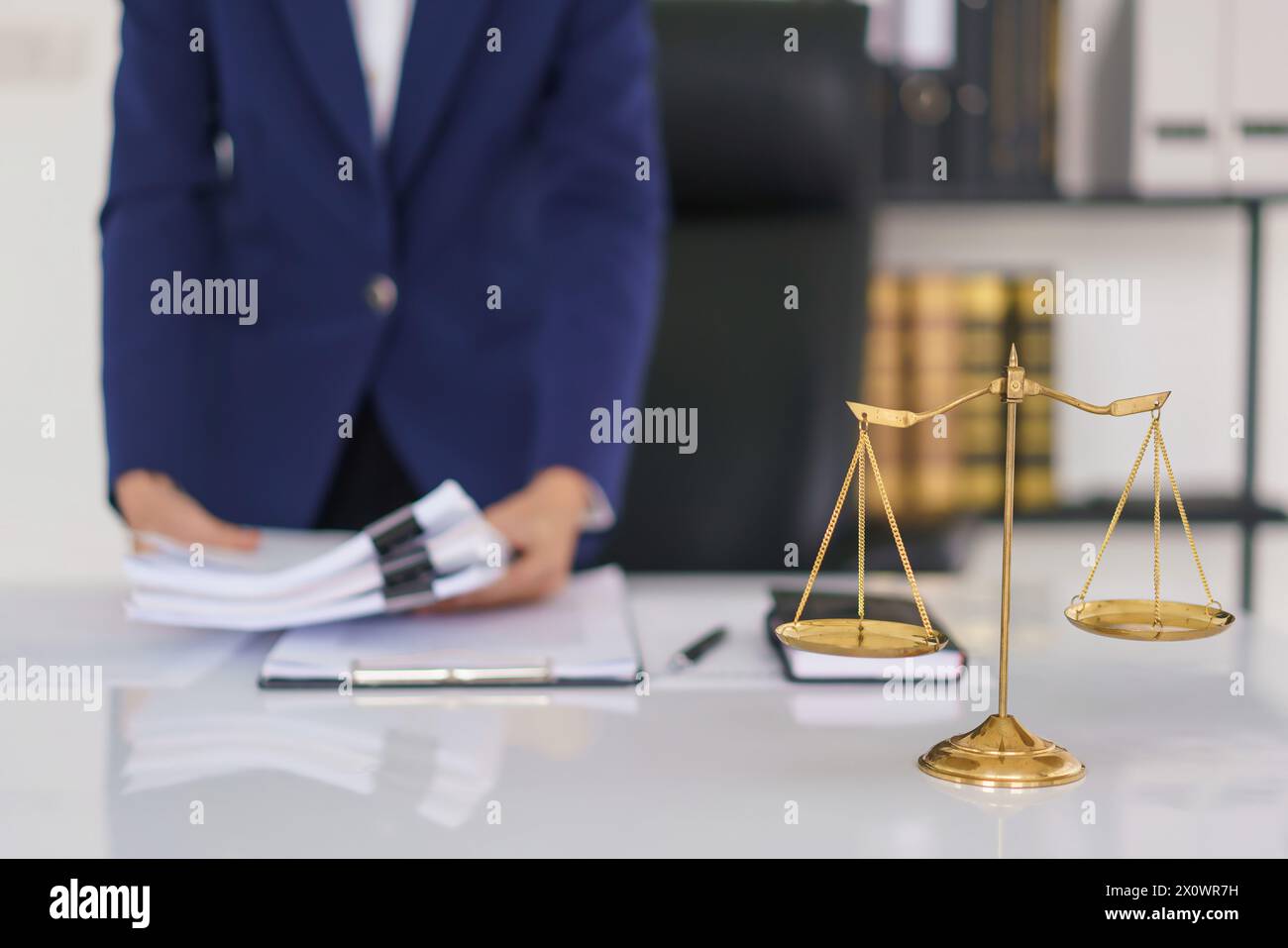 Woman holding justice scale hi-res stock photography and images - Alamy