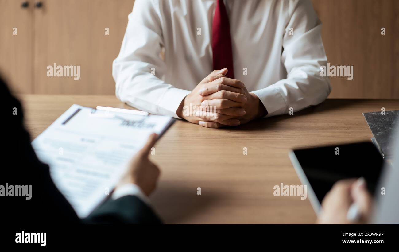 HR manager woman reading resume and writing data on tablet during job ...