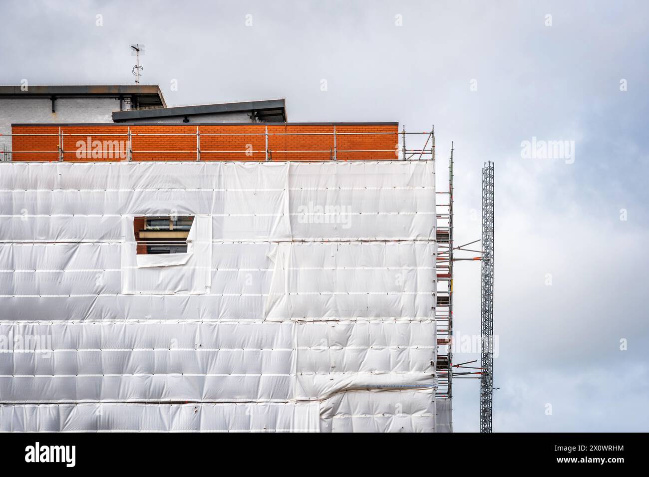 Flame retardant scaffold sheeting wrapped apartments building during ...