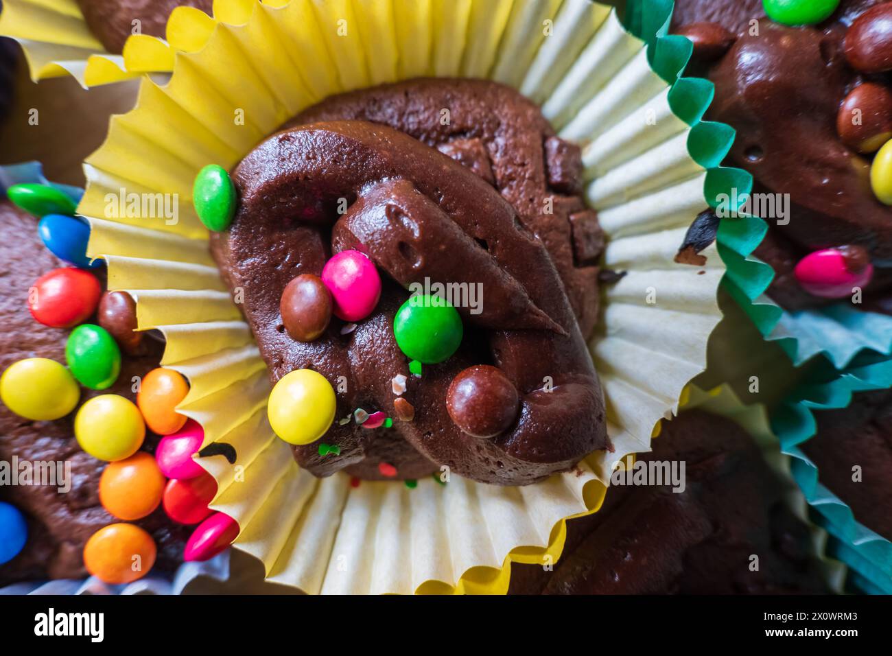 Homemade chocolate cupcakes with chocolate chips and colorful sweets ...