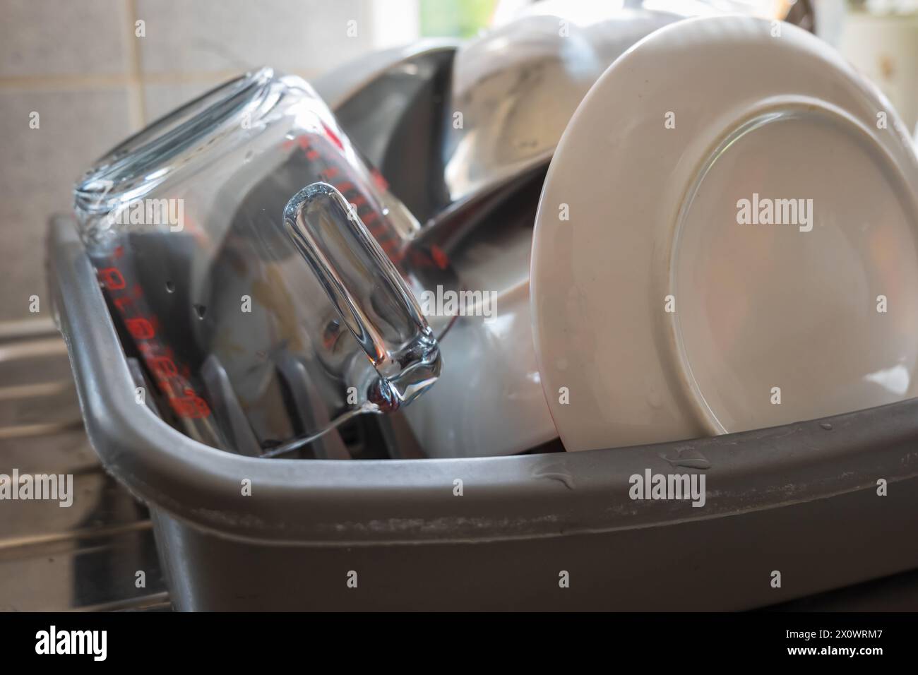 Clean washed glass measuring cup with plates sitting drying rack Stock ...