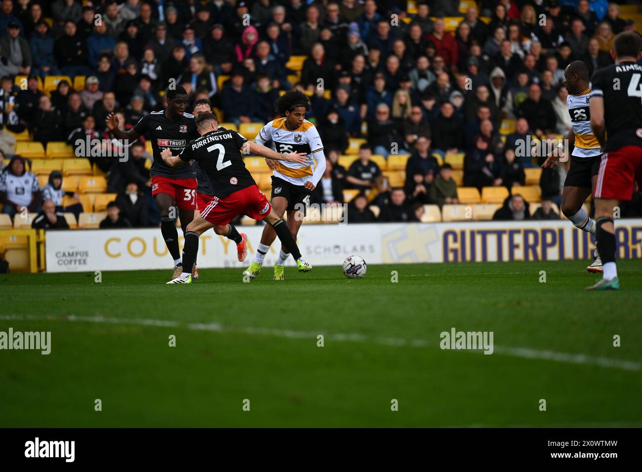 Burslem, UK, 13th April 2024. Port Vale number 25 Baylee Dipepa takes ...