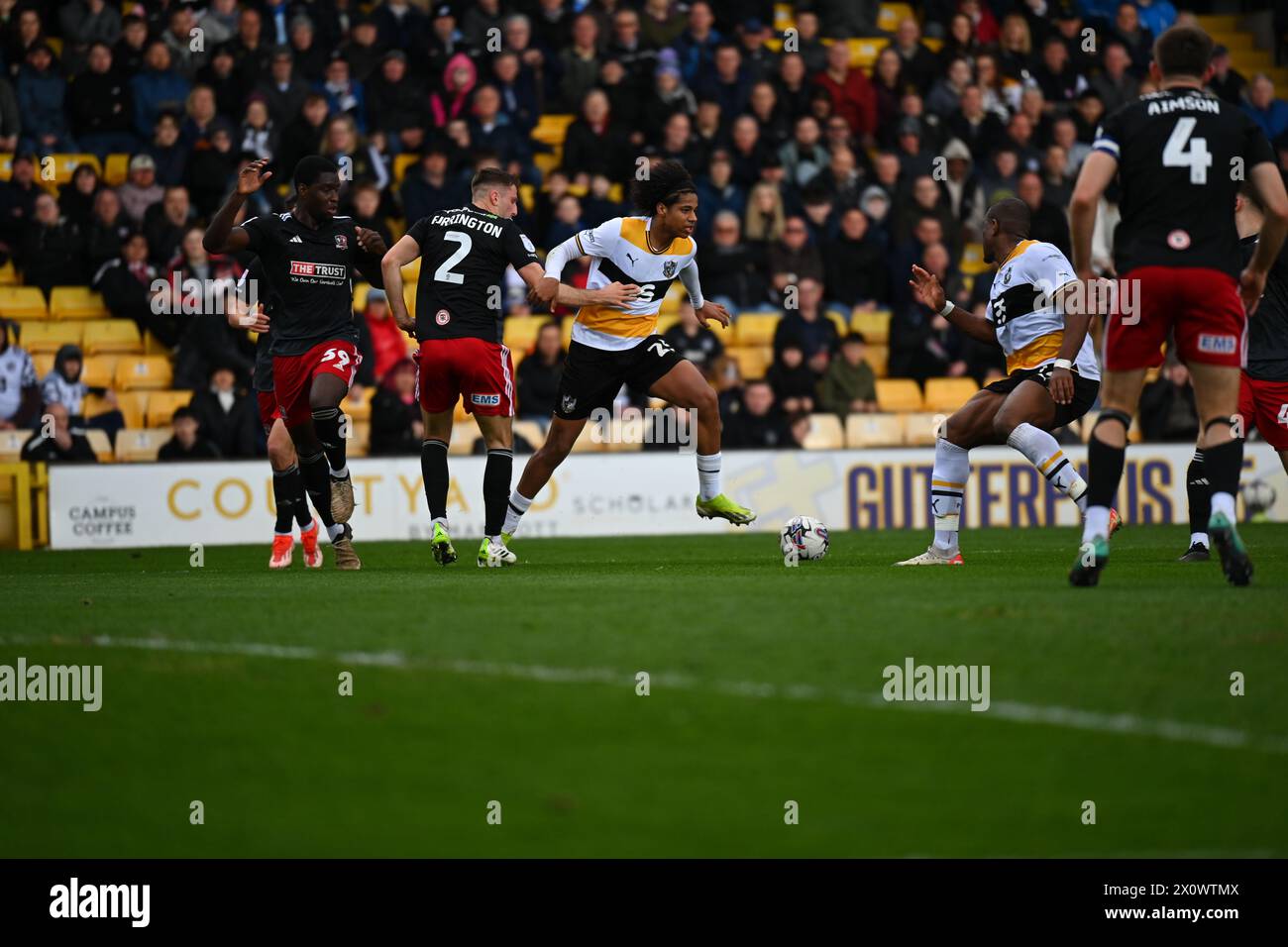 Burslem, UK, 13th April 2024. Port Vale number 25 Baylee Dipepa takes ...