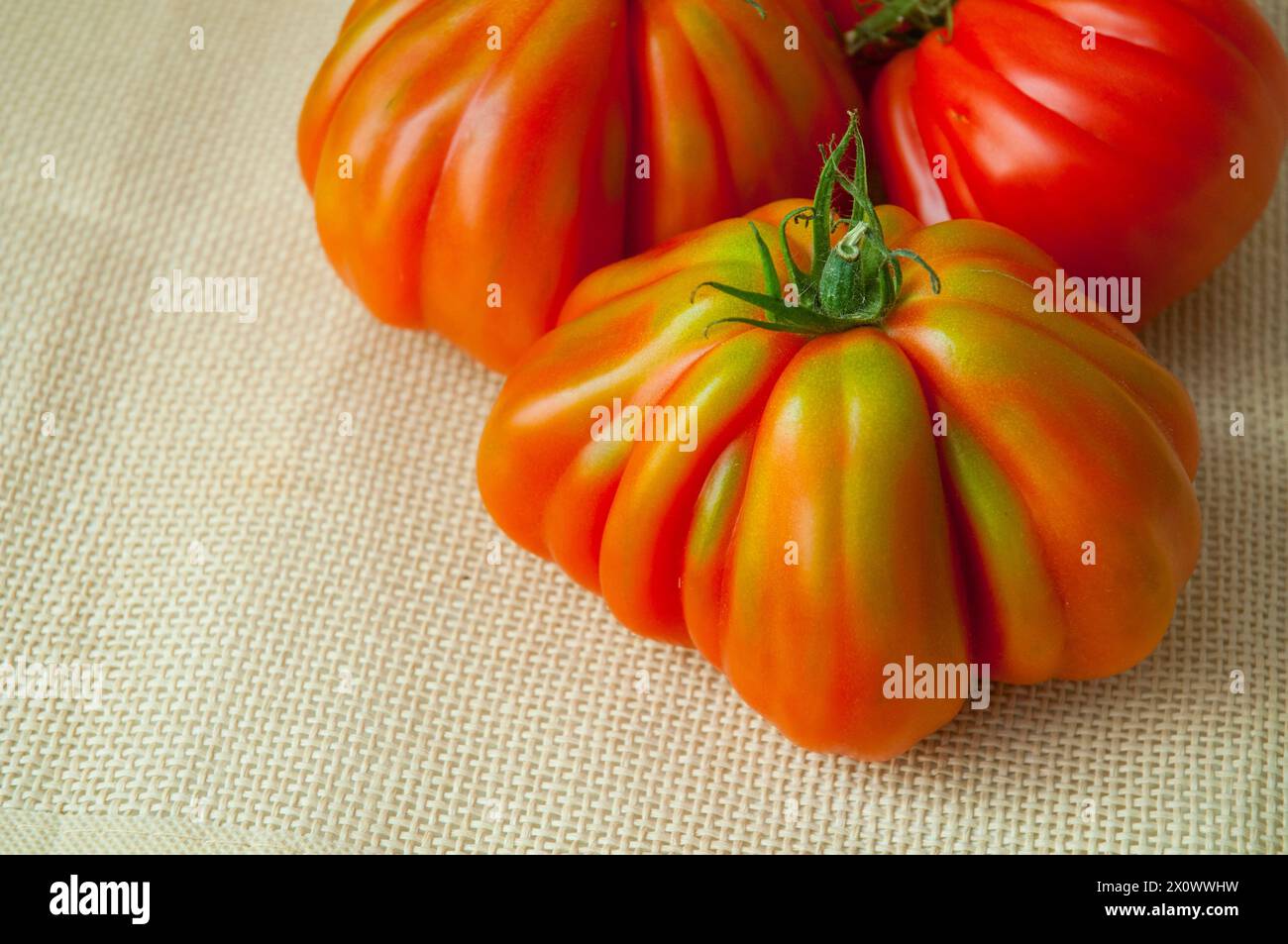 Three raf tomatoes. Close view Stock Photo - Alamy