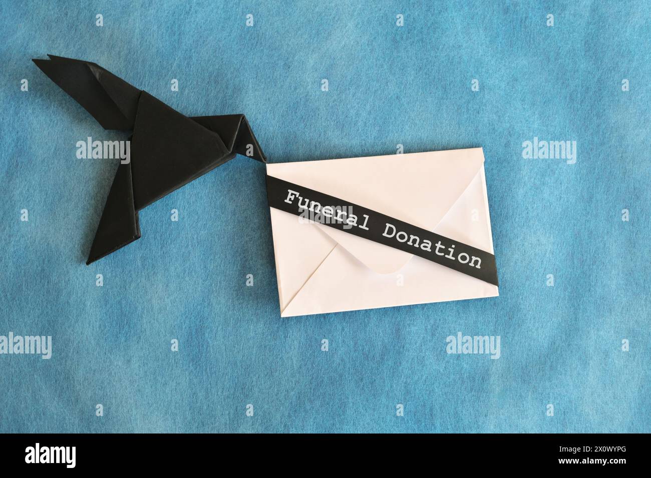 Black raven paper origami carrying white letter money envelope with ...