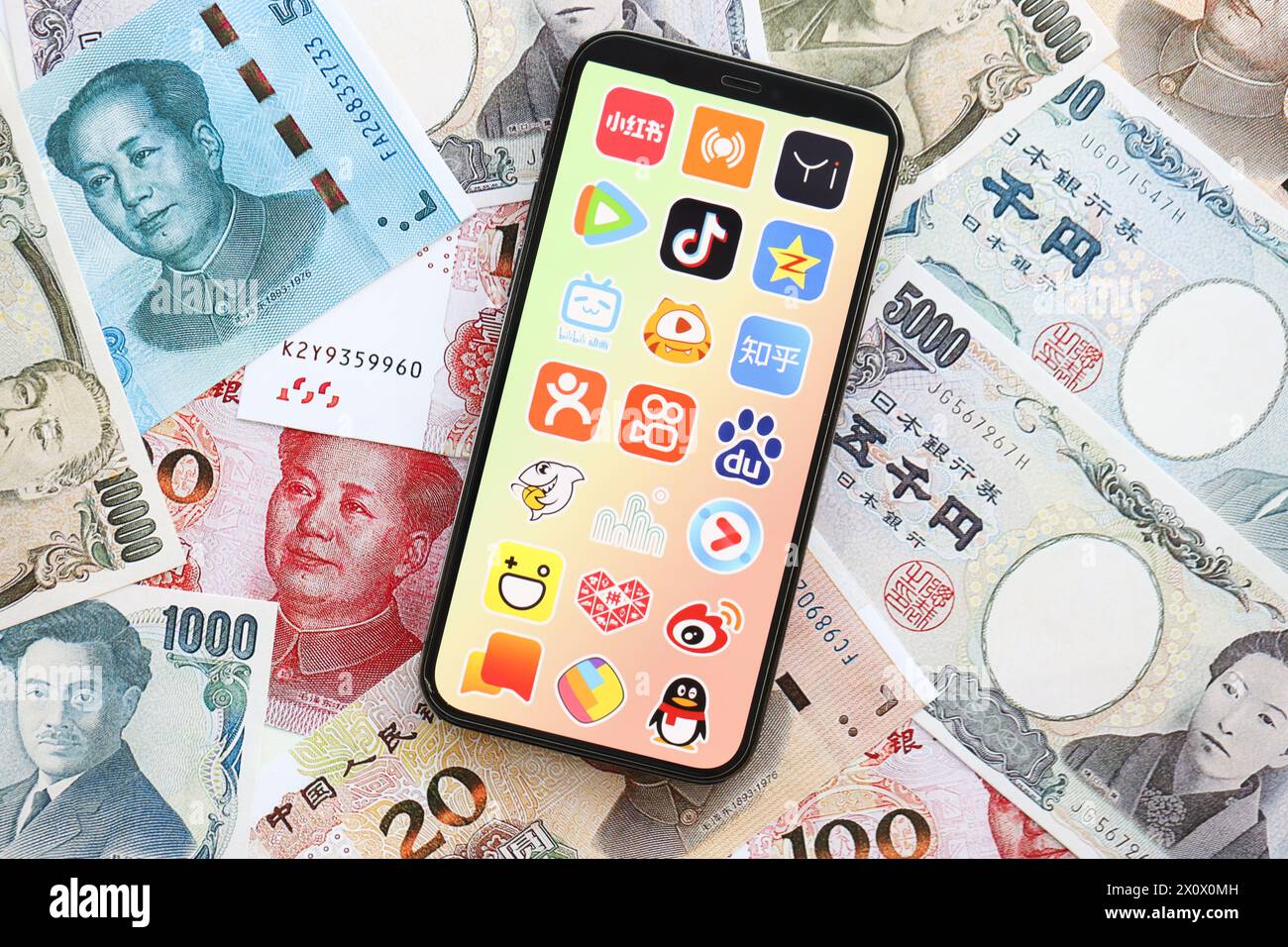 KYIV, UKRAINE - APRIL 1, 2024 Asian apps icon on smartphone screen on ...