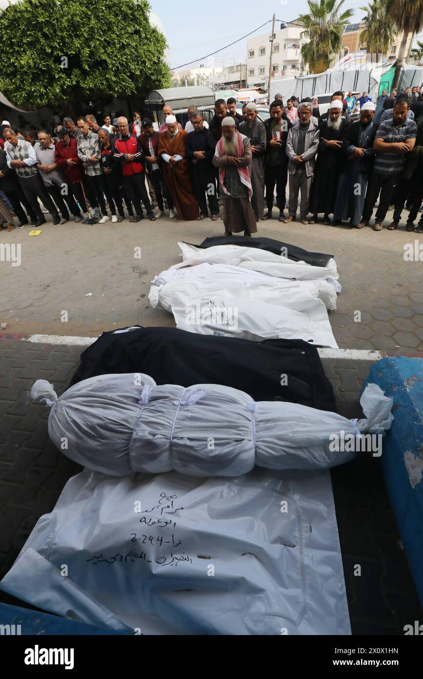 Relatives of the Palestinians died in Israeli attacks, mourn as they ...