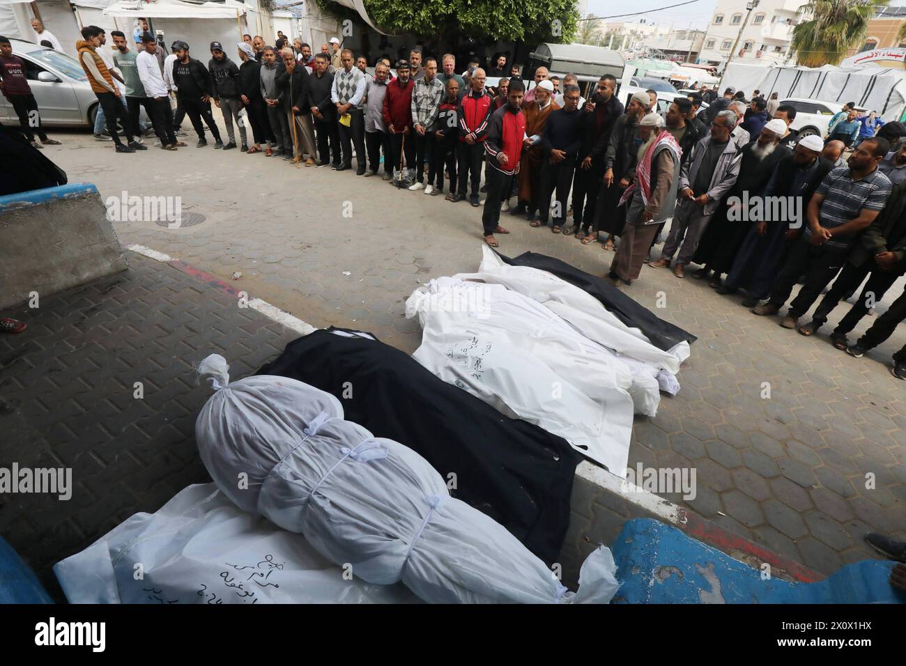 Relatives of the Palestinians died in Israeli attacks, mourn as they ...