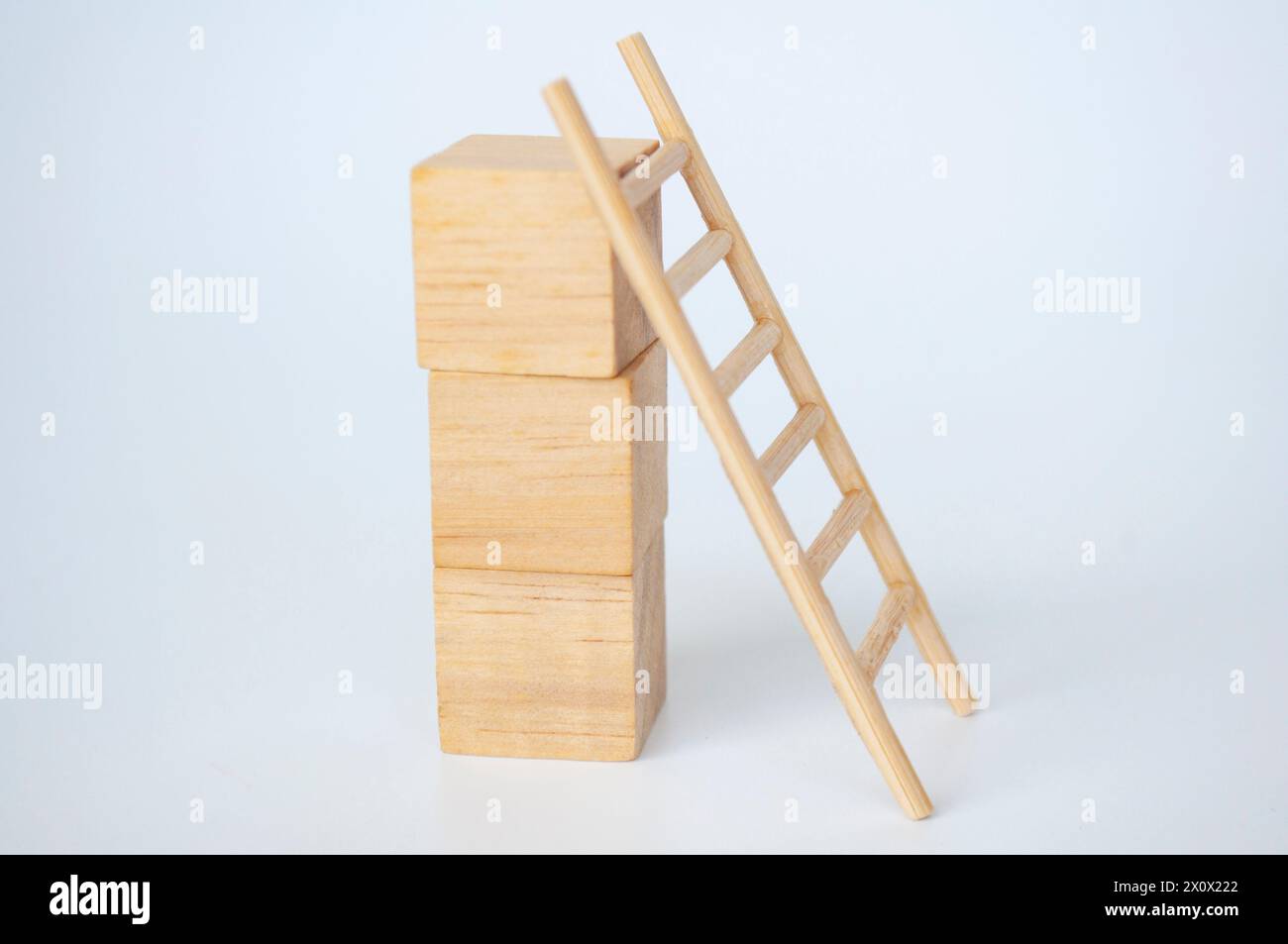 Wooden cubes with ladder on white background with customizable space ...
