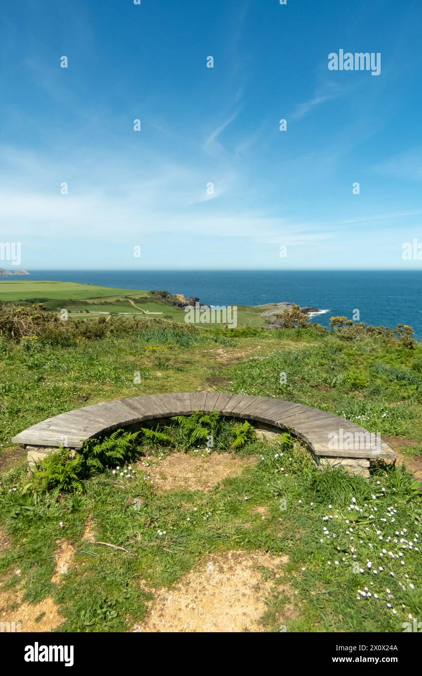 Wooden bench standing on the high ocean cliff near Luanco, Asturias ...