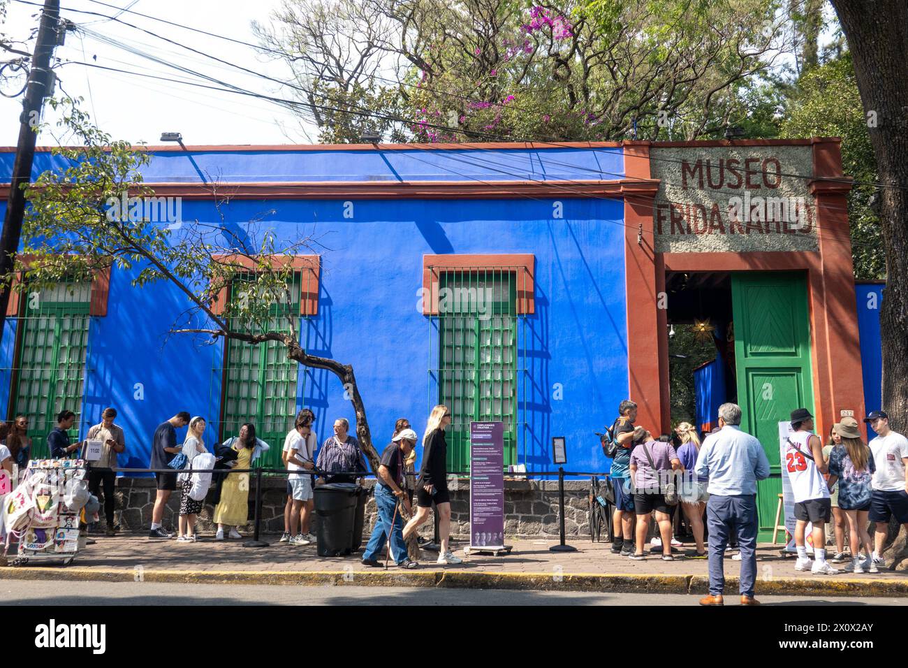 Visitors wait in line outside The Frida Kahlo Blue House Museum. The ...