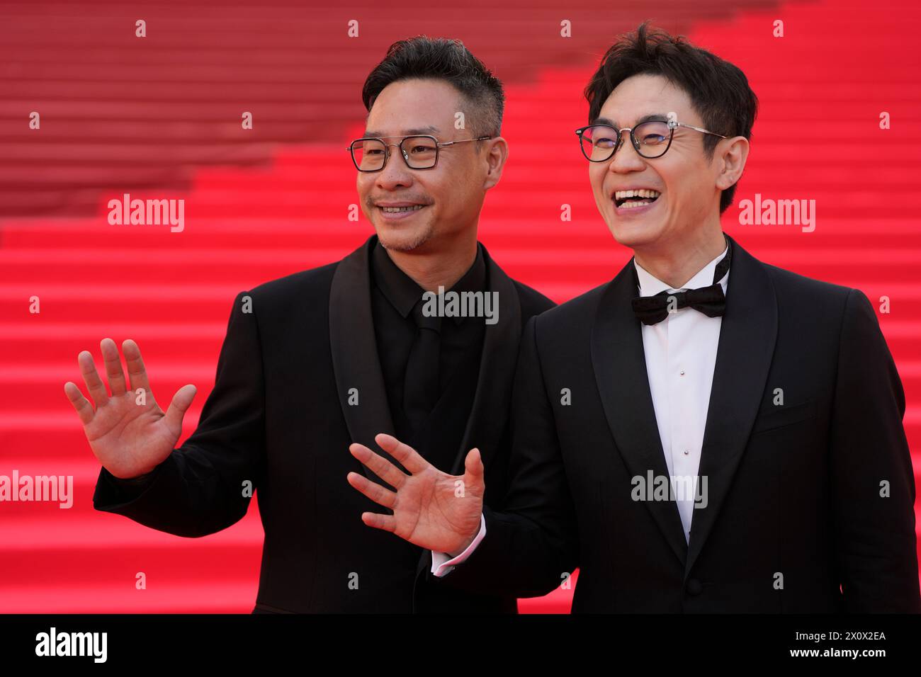 Hong Kong film director Johnathan Li, left and Chinese actor Dong ...