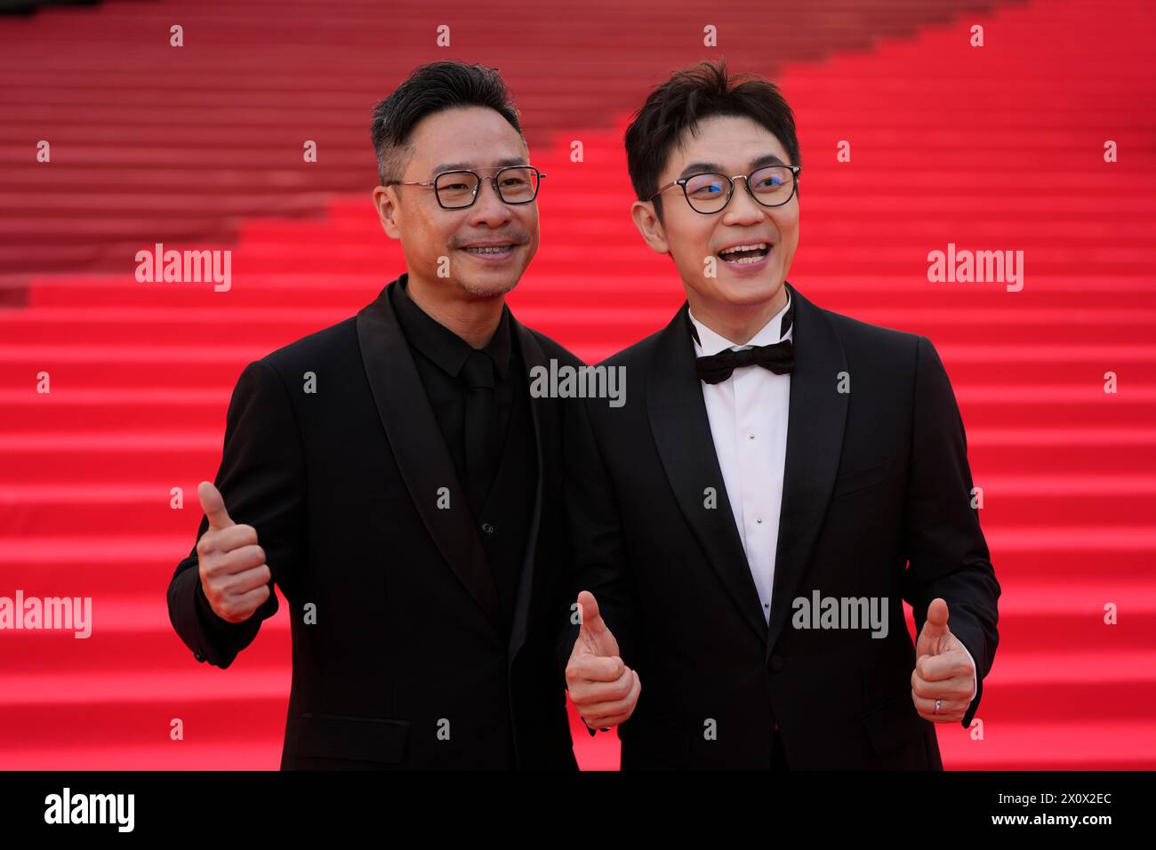 Hong Kong film director Johnathan Li, left and Chinese actor Dong ...