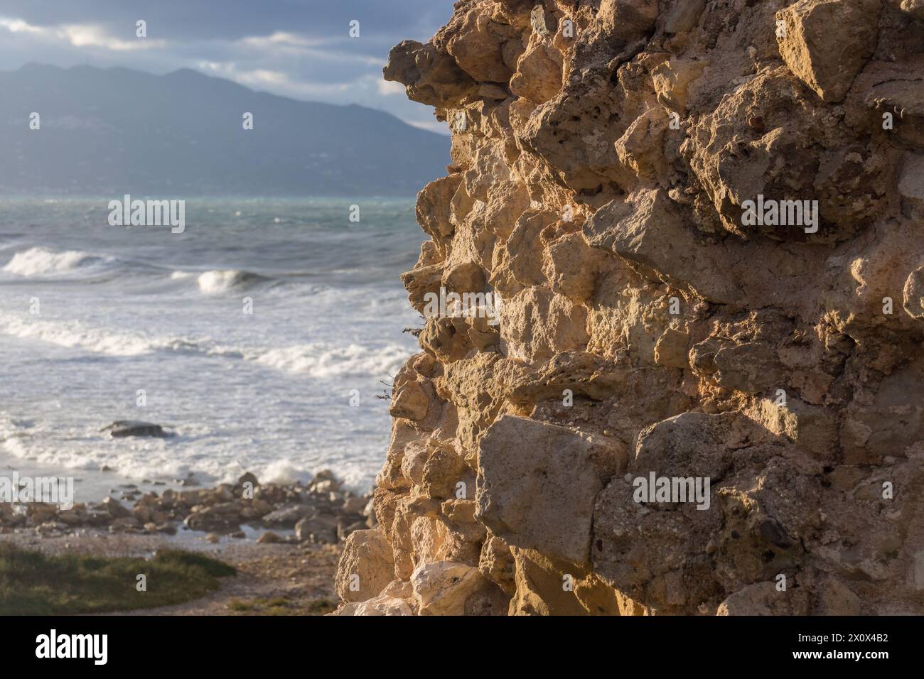 Windy day at the beach. Big waves. view from a rocky spot above tha ...
