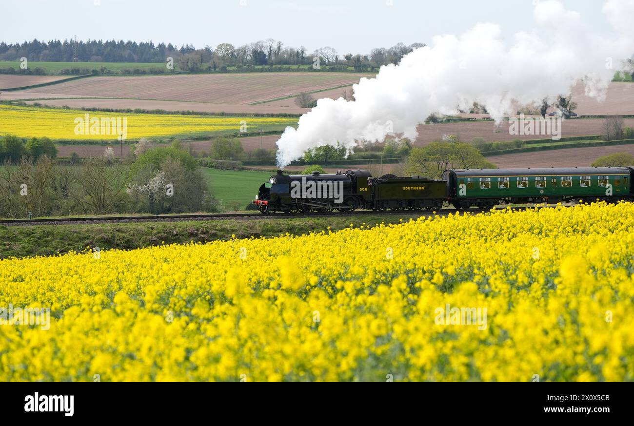The S15 class steam locomotive 506 travels along the Mid Hants Railway ...