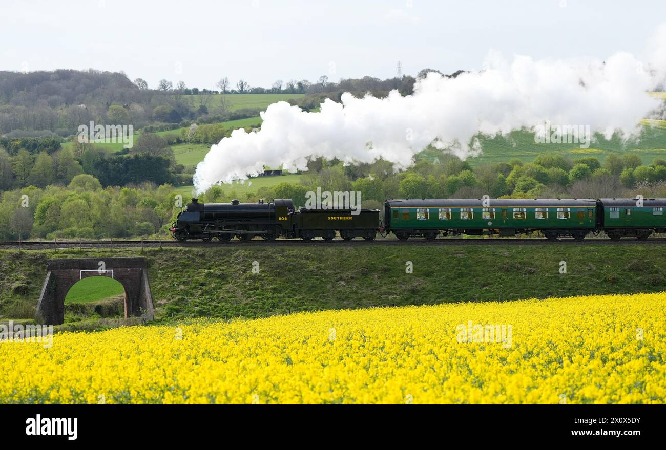 The S15 class steam locomotive 506 travels along the Mid Hants Railway ...
